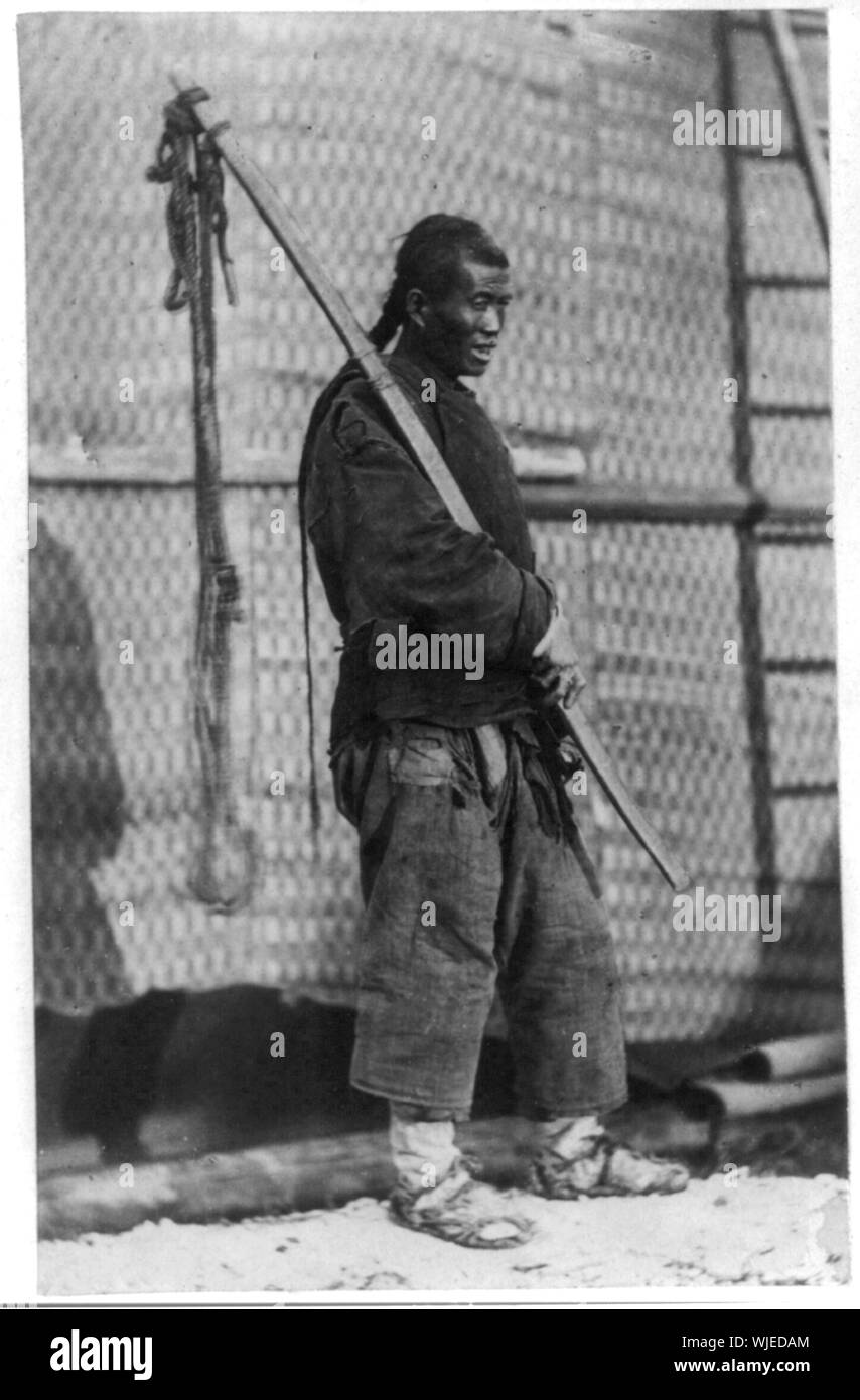 Headdress, coolie Summary: Photograph shows a Chinese laborer, full ...