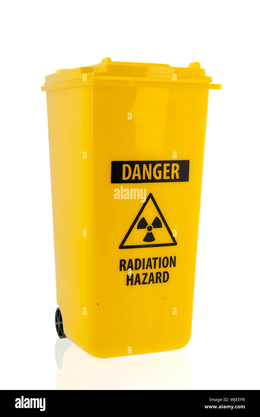 yellow trash can for radioactive garbage isolated over white background ...
