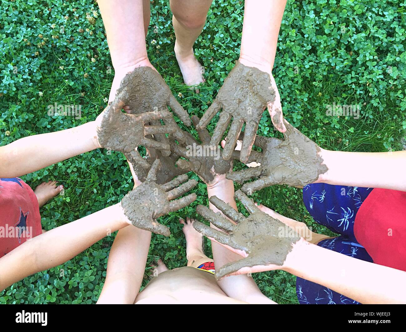 Hands with mud hi-res stock photography and images - Alamy
