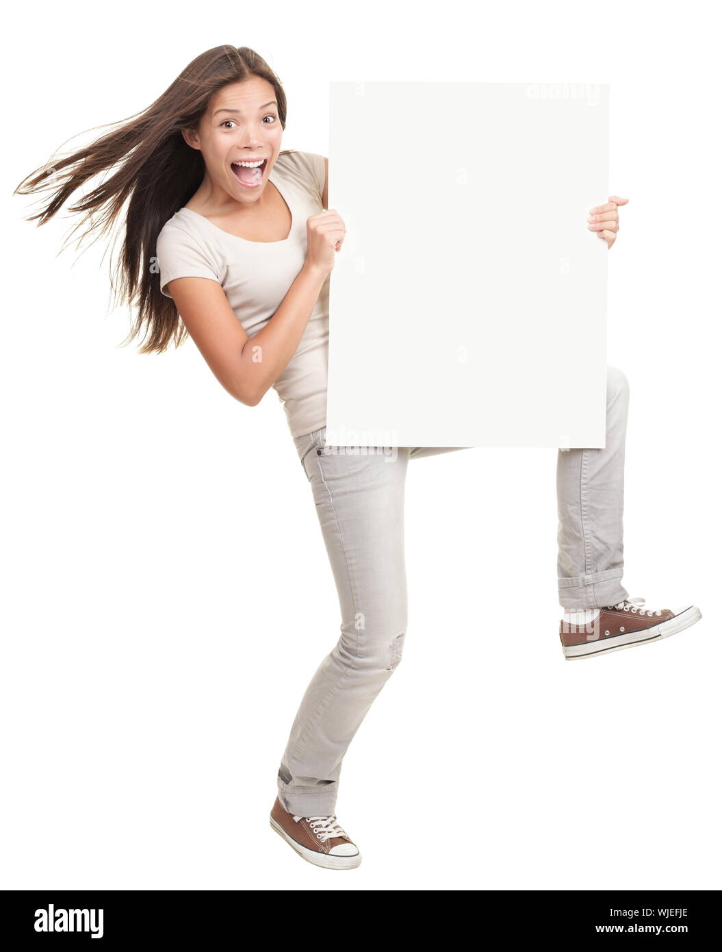Banner ad woman holding a blank white poster billboard - excited and ...