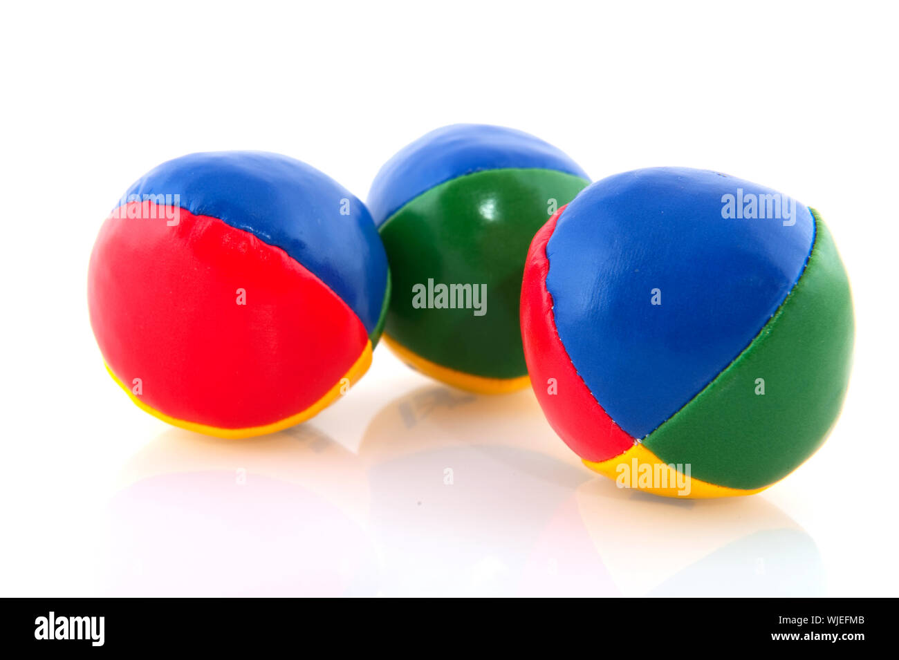 three colorul balls in a row isolated over white Stock Photo - Alamy