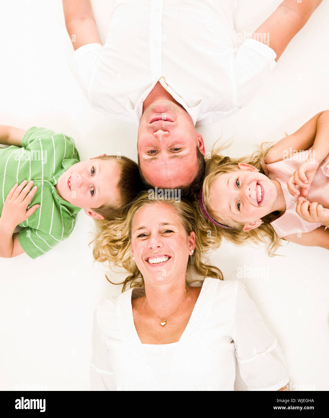 Family from above isolated on white background Stock Photo - Alamy
