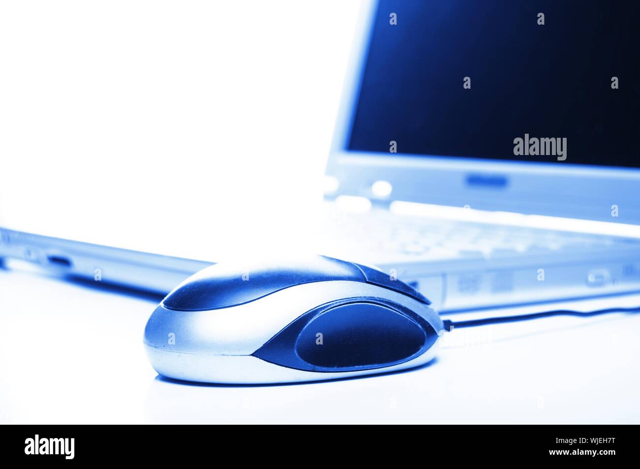 laptop and pc or computer mouse showing technology concept Stock Photo ...
