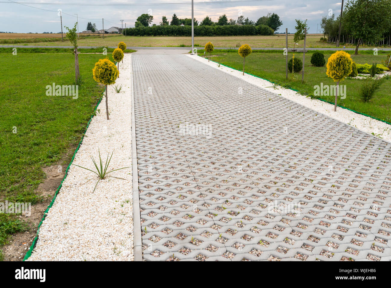 Entry for cars into the property made of openwork concrete pavement ...