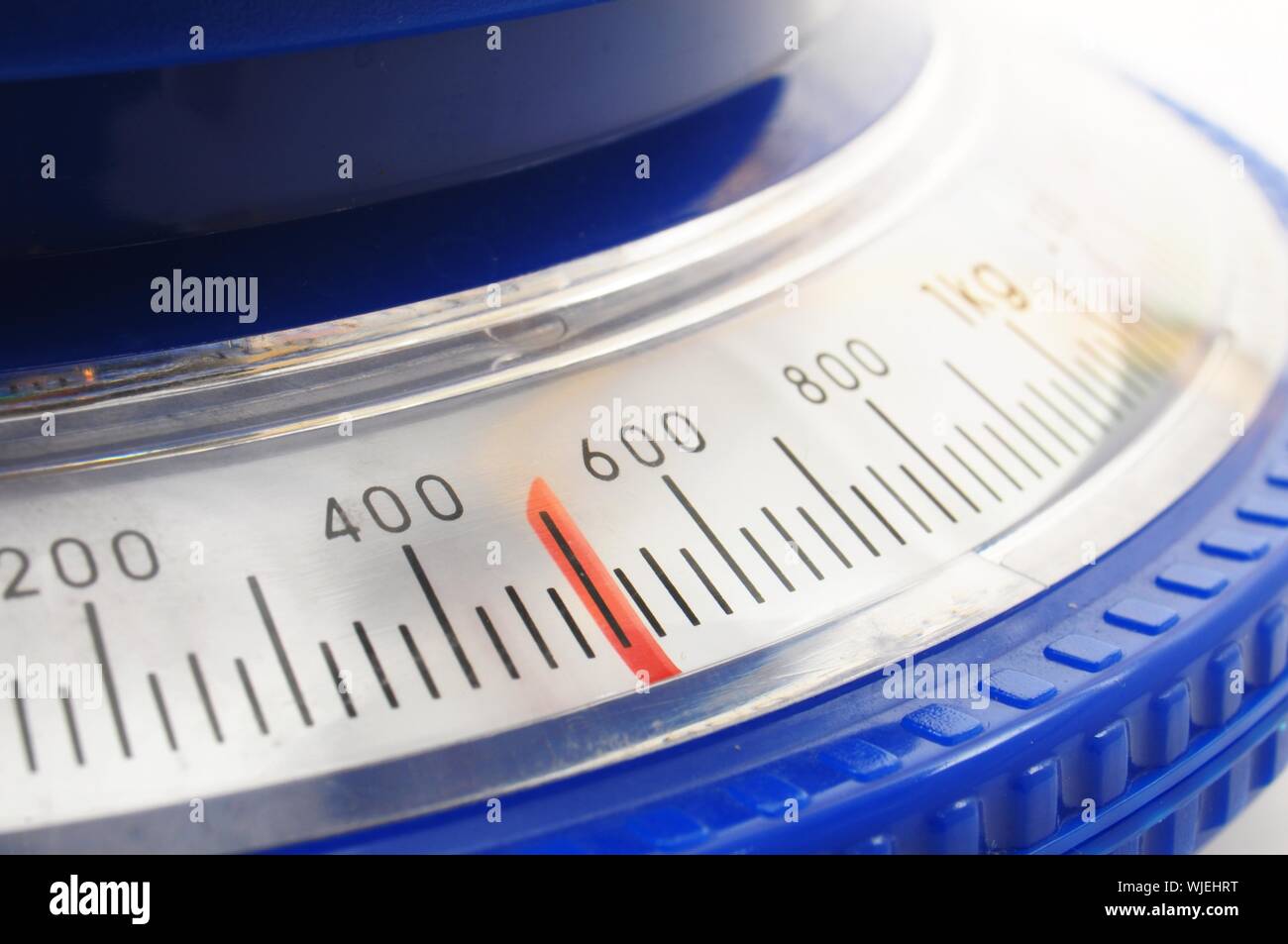 blue kitchen scales or balance showing cooking concept Stock Photo - Alamy