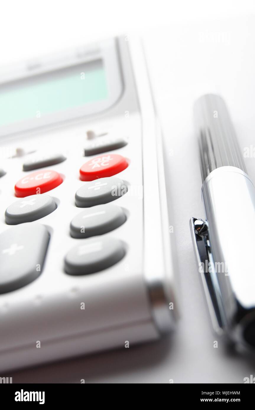 business calculation concept with modern white calculator Stock Photo ...