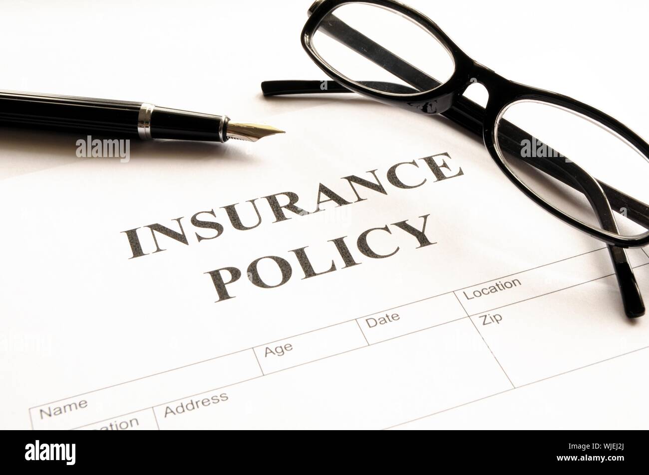 insurance policy form on desk in office showing risk concept Stock ...