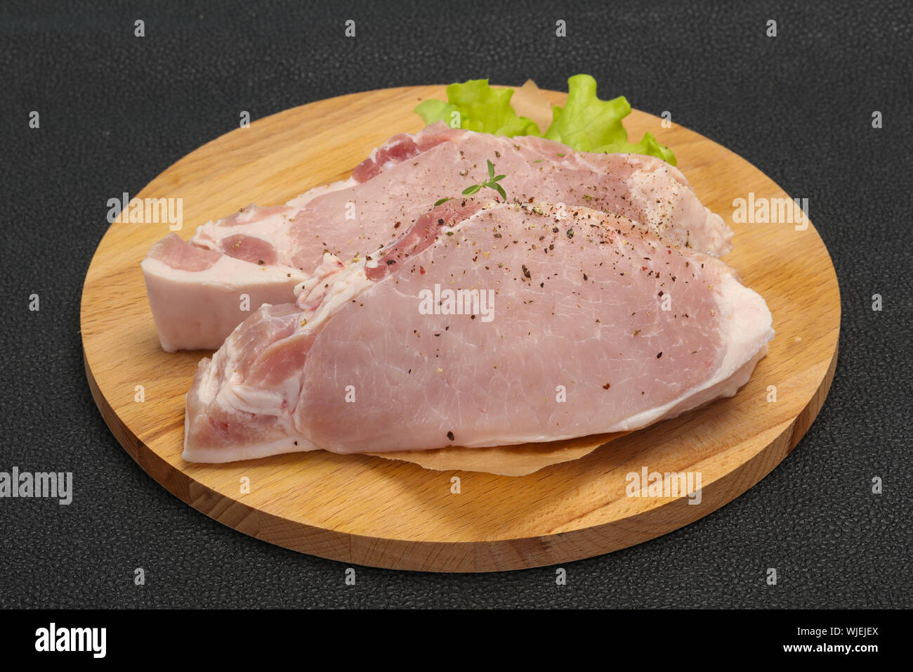 Raw pork meat steak ready for grill Stock Photo - Alamy