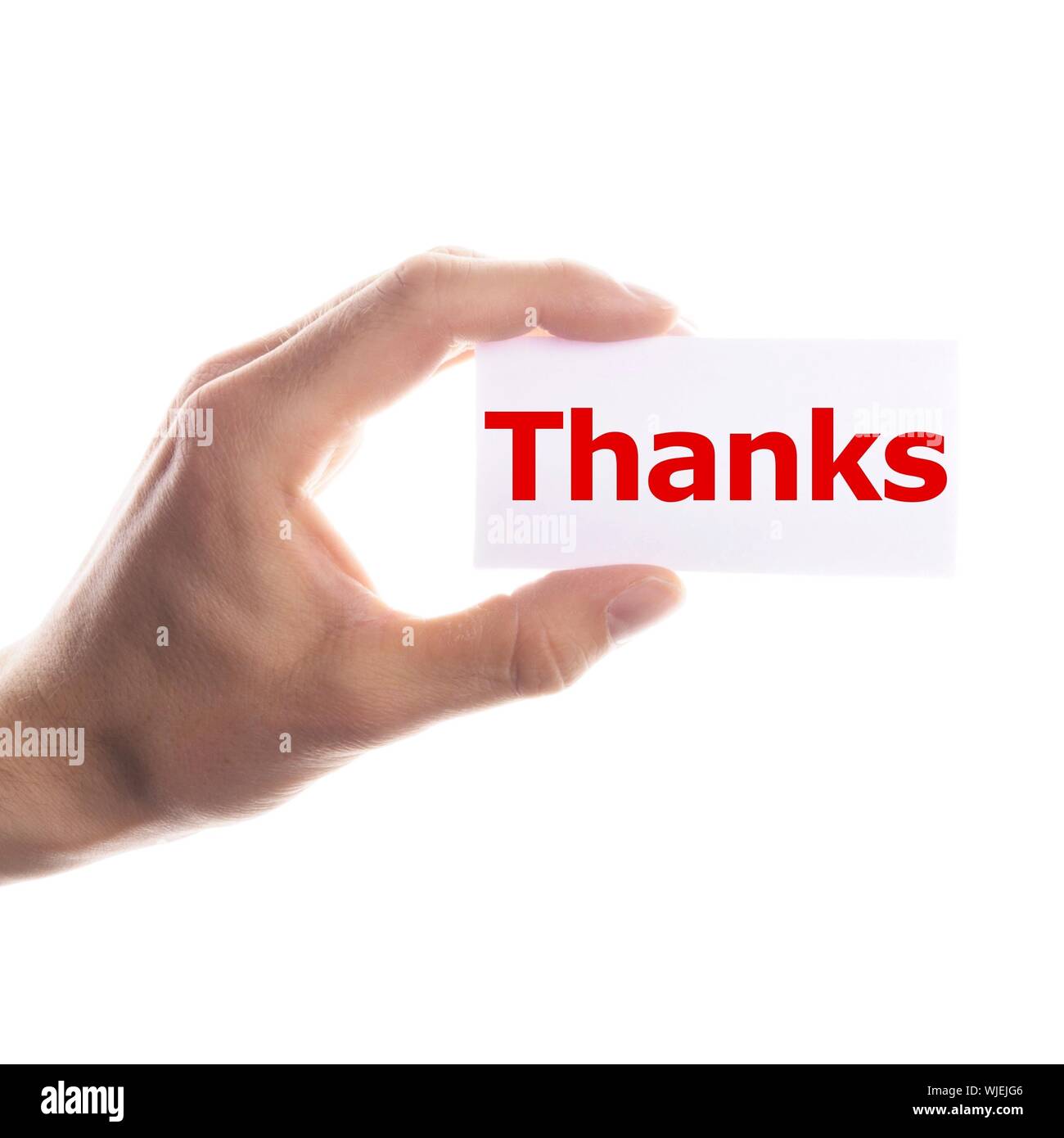 thank you or thanks concept with hand word and paper Stock Photo - Alamy