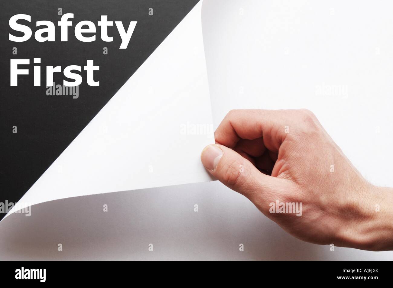 safety first concept with hand word and paper Stock Photo - Alamy