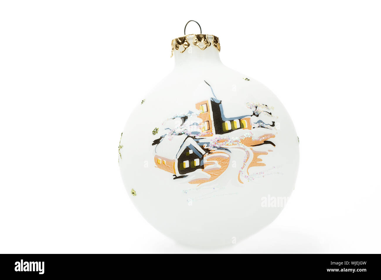 dull christmas ball with village scenic painting on white background ...