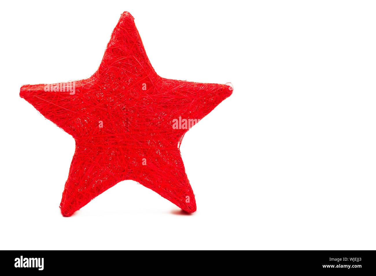 one red thread made star on white background Stock Photo - Alamy