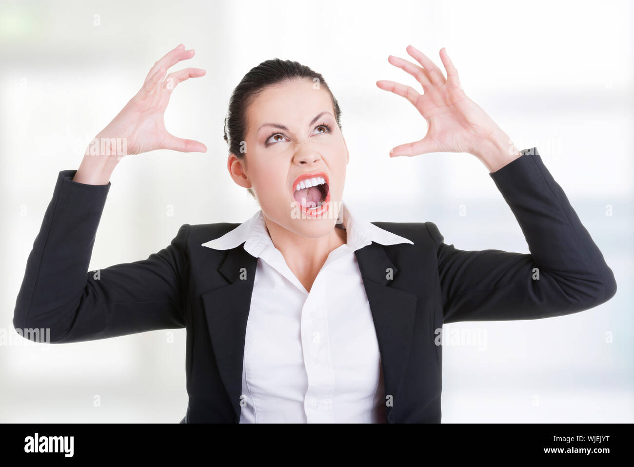 Stressed or angry businesswoman screaming loud Stock Photo - Alamy