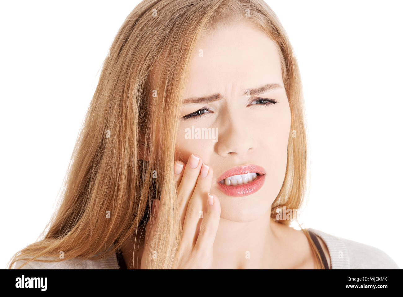 Beautiful casual woman with toothache. Isolated on white Stock Photo ...