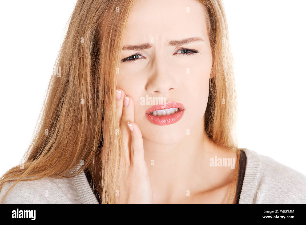 Beautiful casual woman with toothache. Isolated on white Stock Photo ...