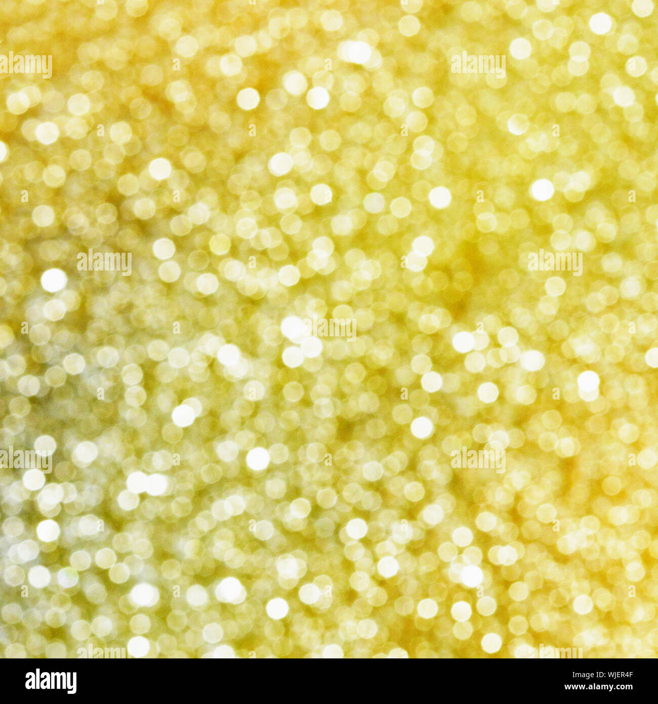 Abstract yellow sparkling bright background - a square Stock Photo - Alamy