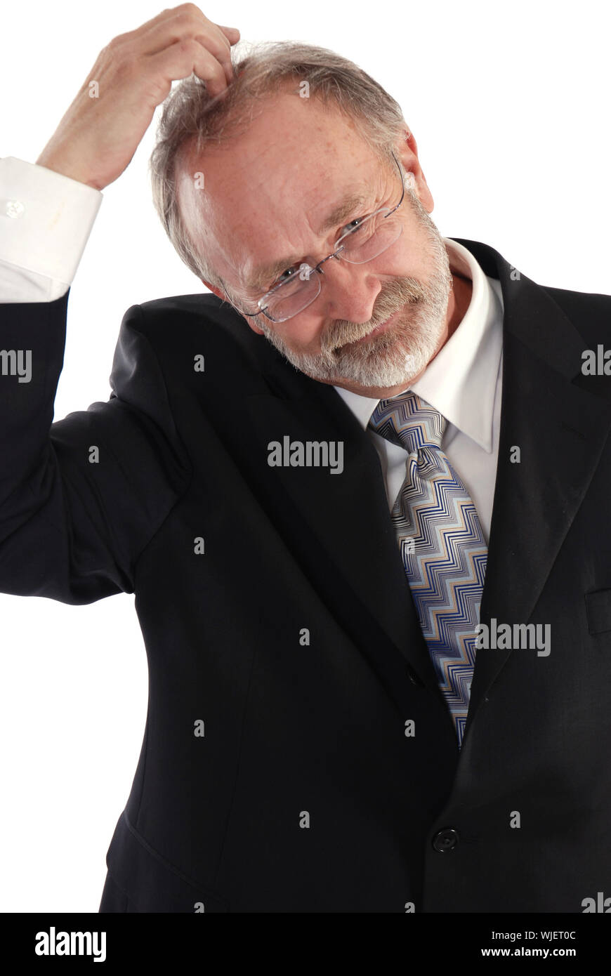 Senior businessman scratching his head Stock Photo - Alamy