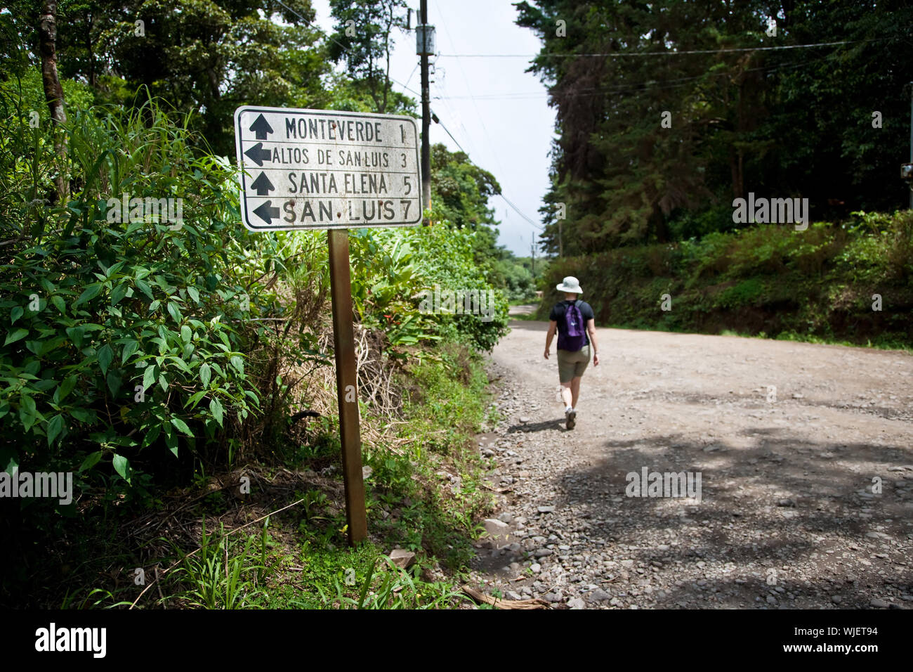 Hiker near sign at intersection in Santa Elena Costa Rica Stock Photo ...