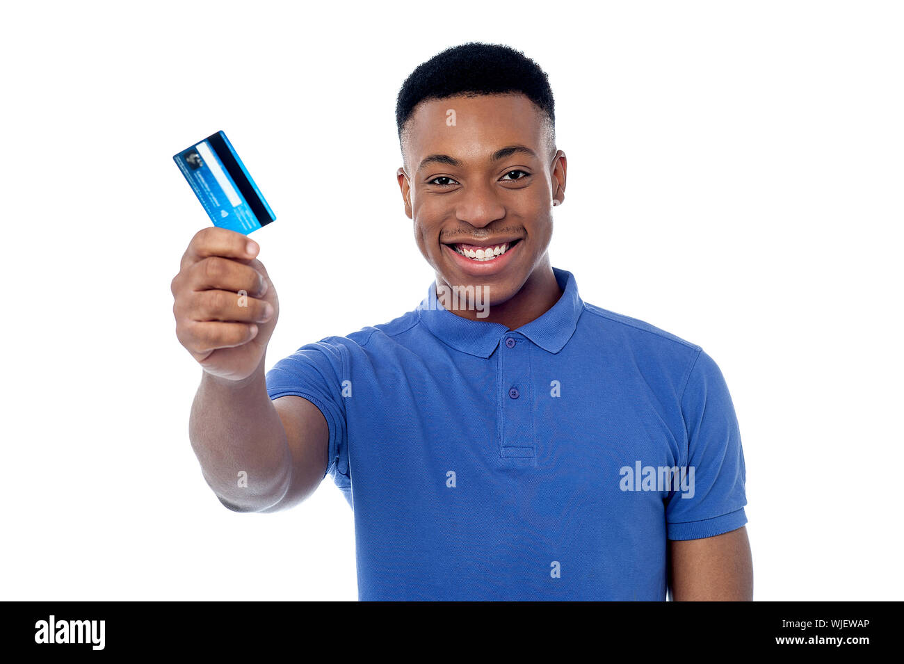 Handsome young man showing his debit card to camera Stock Photo - Alamy
