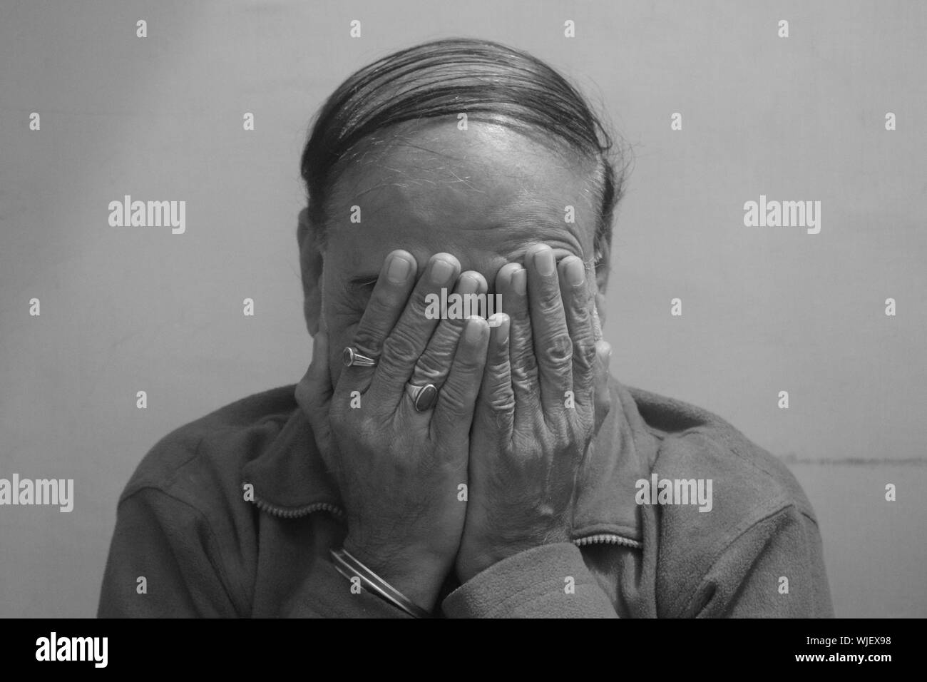 Close-up Of Human Hands On Face Stock Photo - Alamy