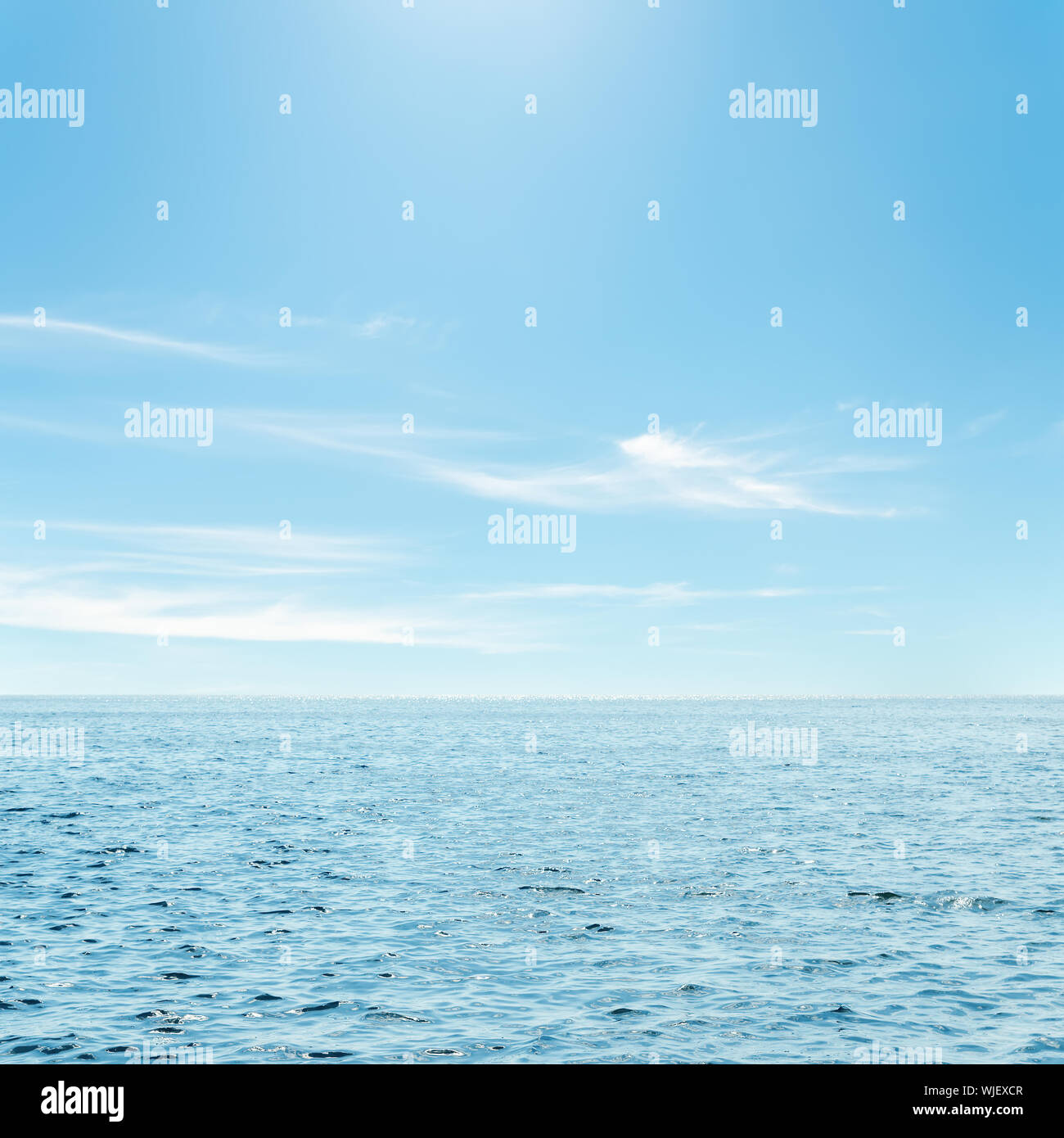 blue sea and clouds in sky over it Stock Photo - Alamy