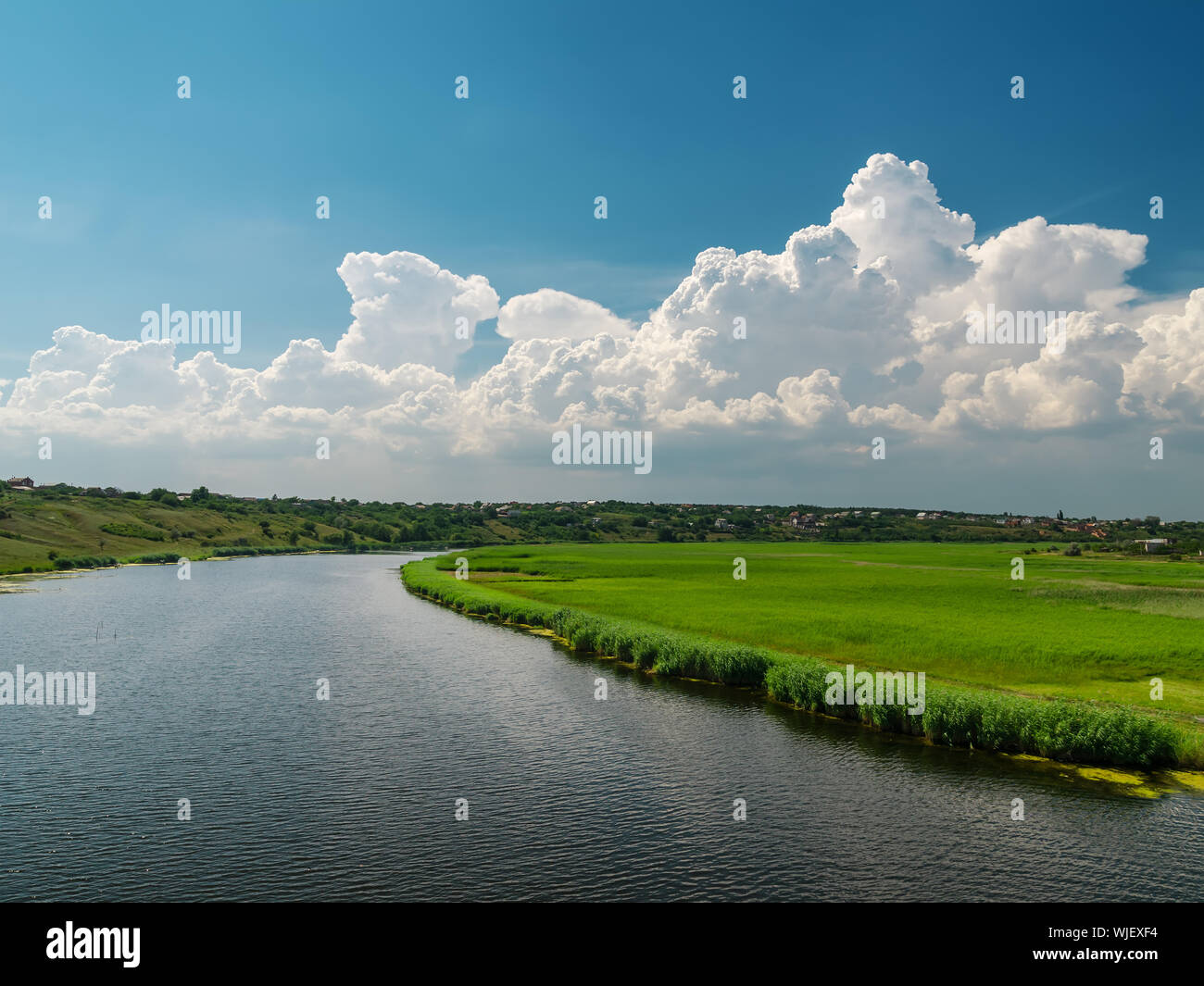 white clouds over river Stock Photo - Alamy