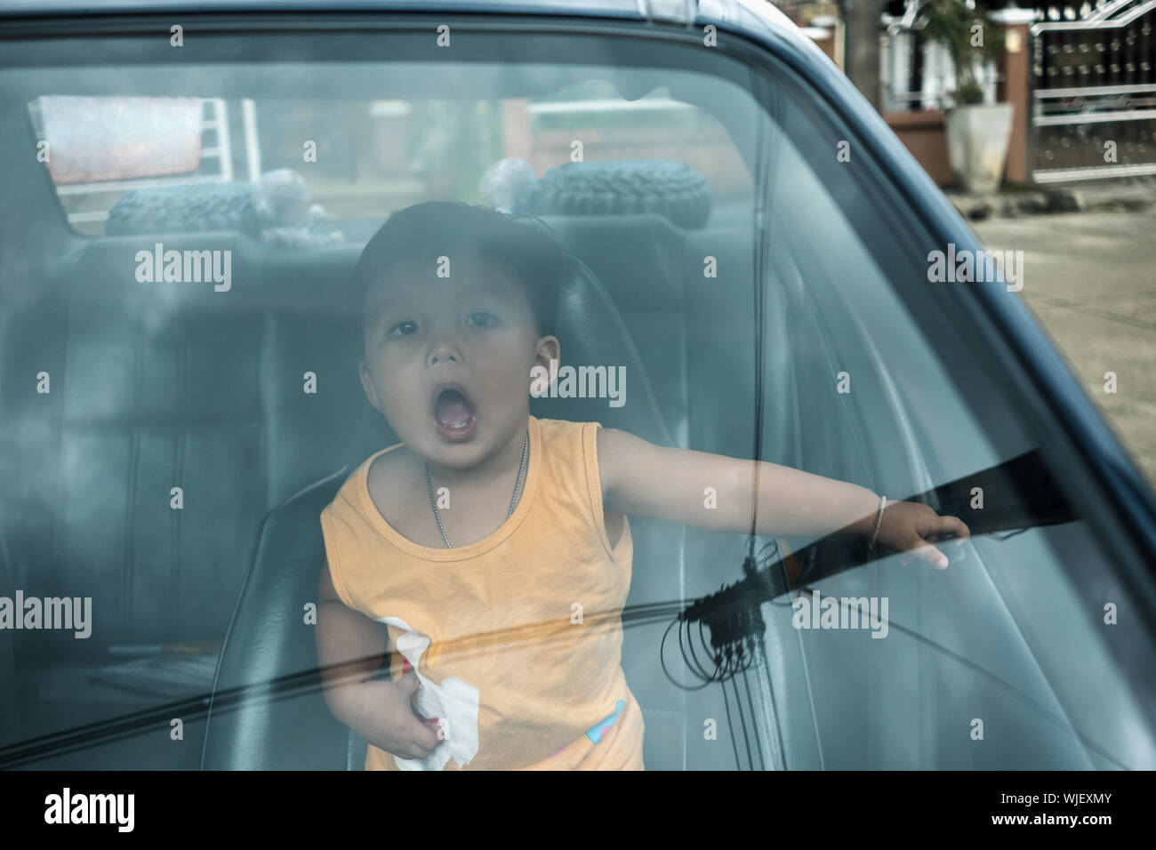 Boy looking through windshield hi-res stock photography and images - Alamy