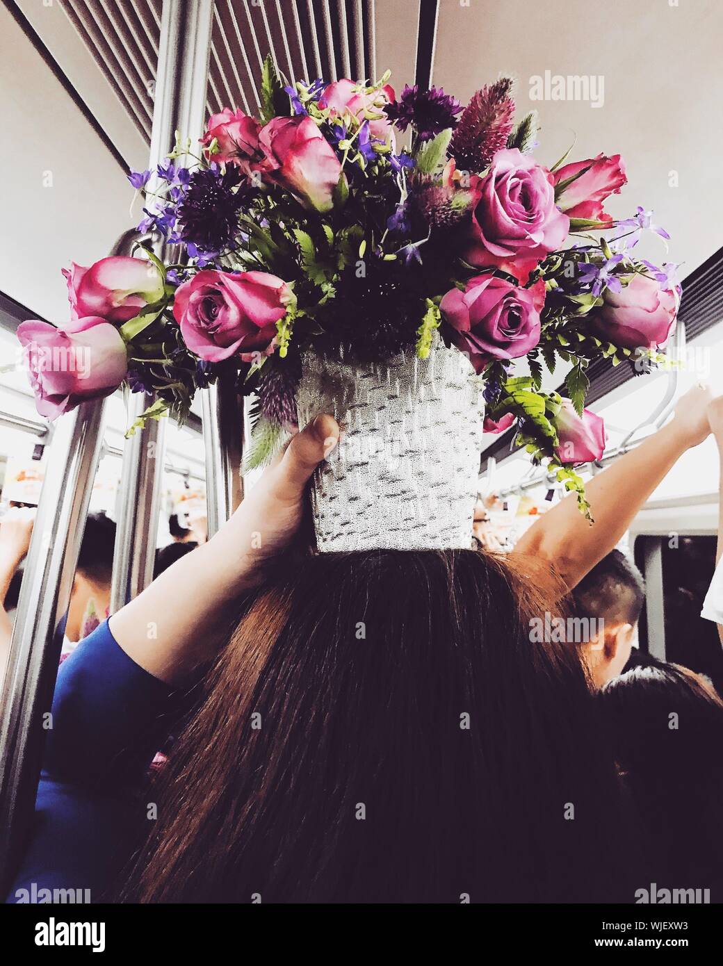 Woman carrying bouquet hi-res stock photography and images - Alamy