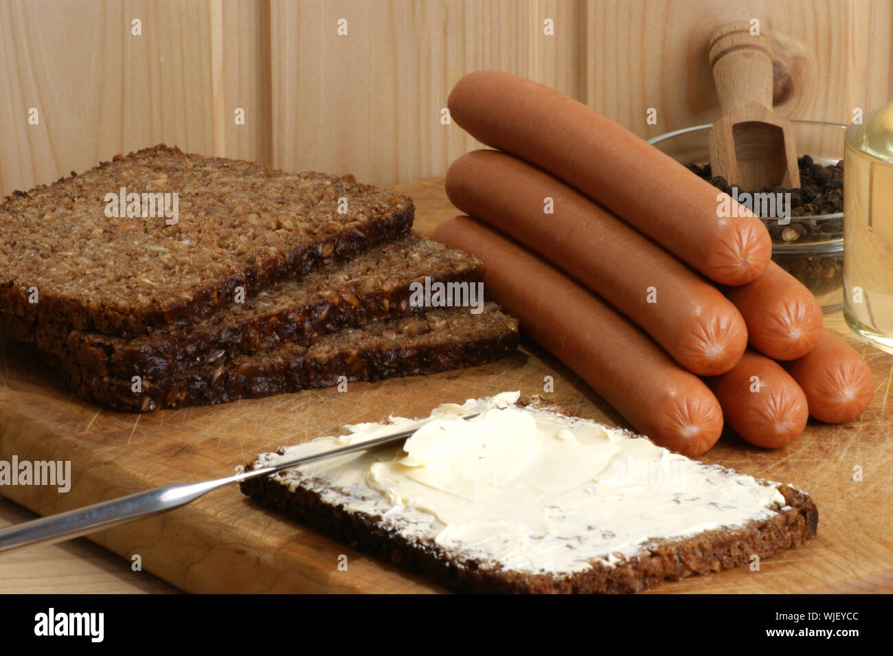 sausage, also known as knackwurst, on a timber board Stock Photo - Alamy