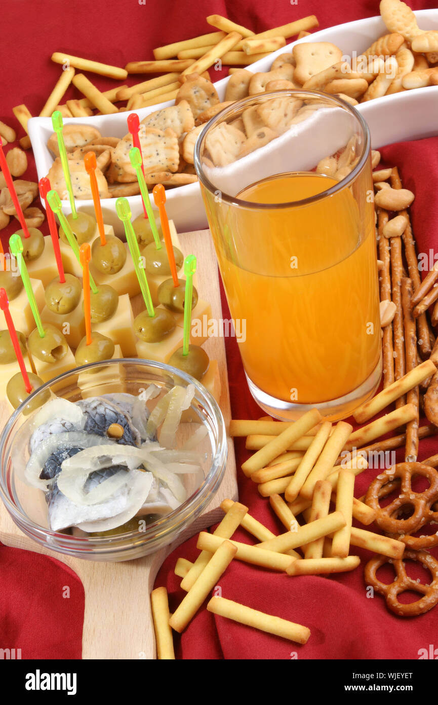 soft drink in a glass and snacks in the background Stock Photo - Alamy