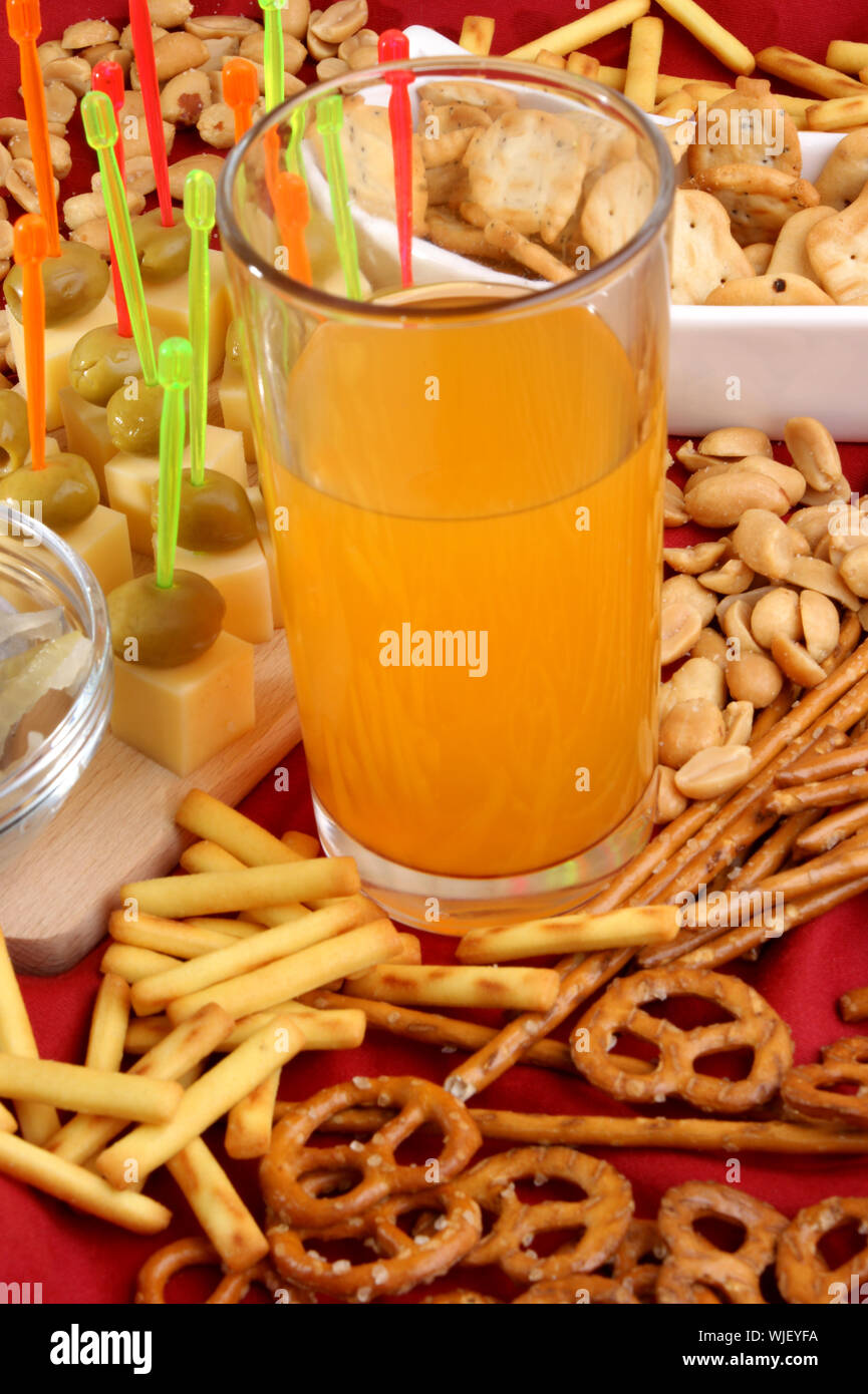 soft drink in a glass and snacks in the background Stock Photo - Alamy