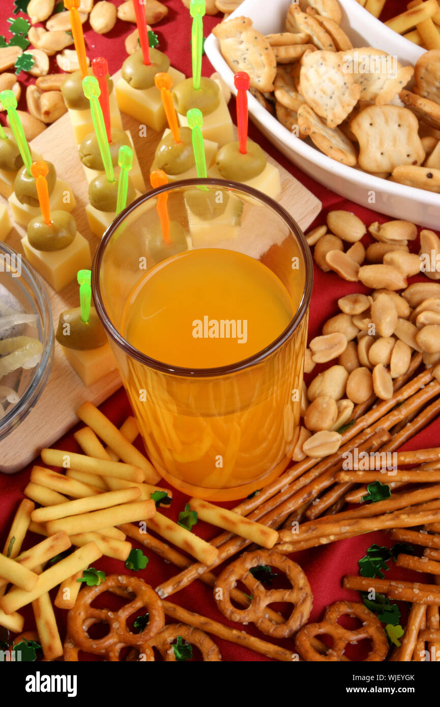 soft drink in a glass and snacks in the background Stock Photo - Alamy