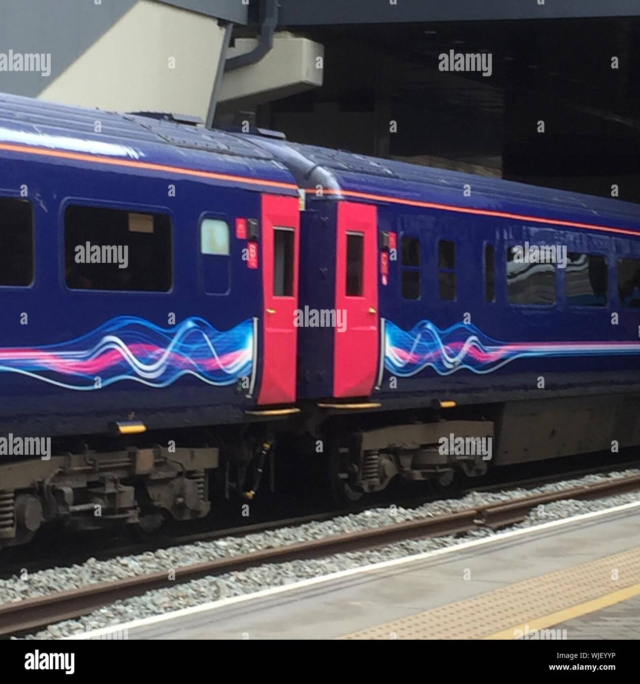 Blue passenger train hi-res stock photography and images - Alamy