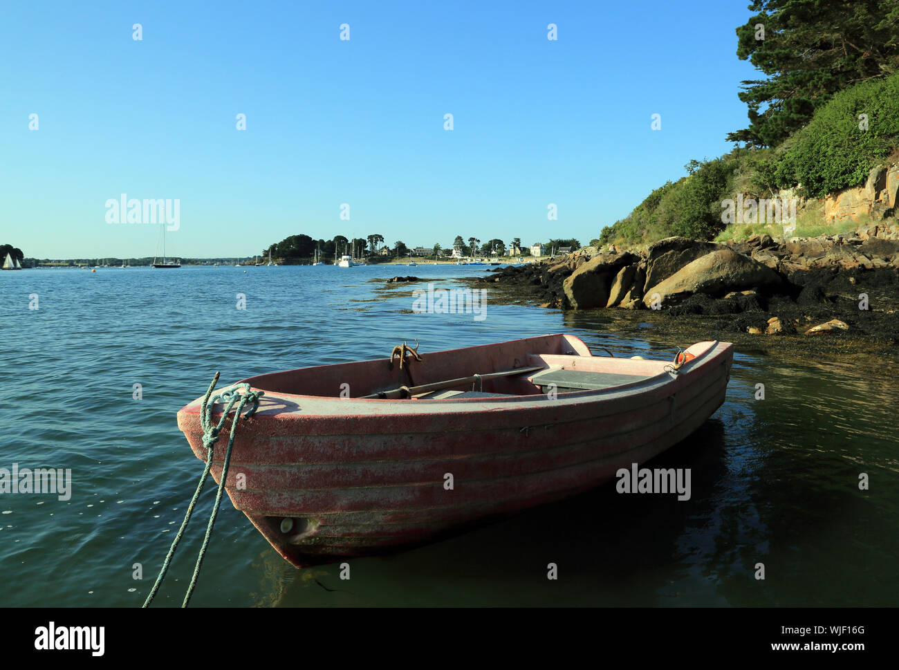 Moored rowing boat from jetty at Sentier Cotier, Gazolven, Ile aux ...