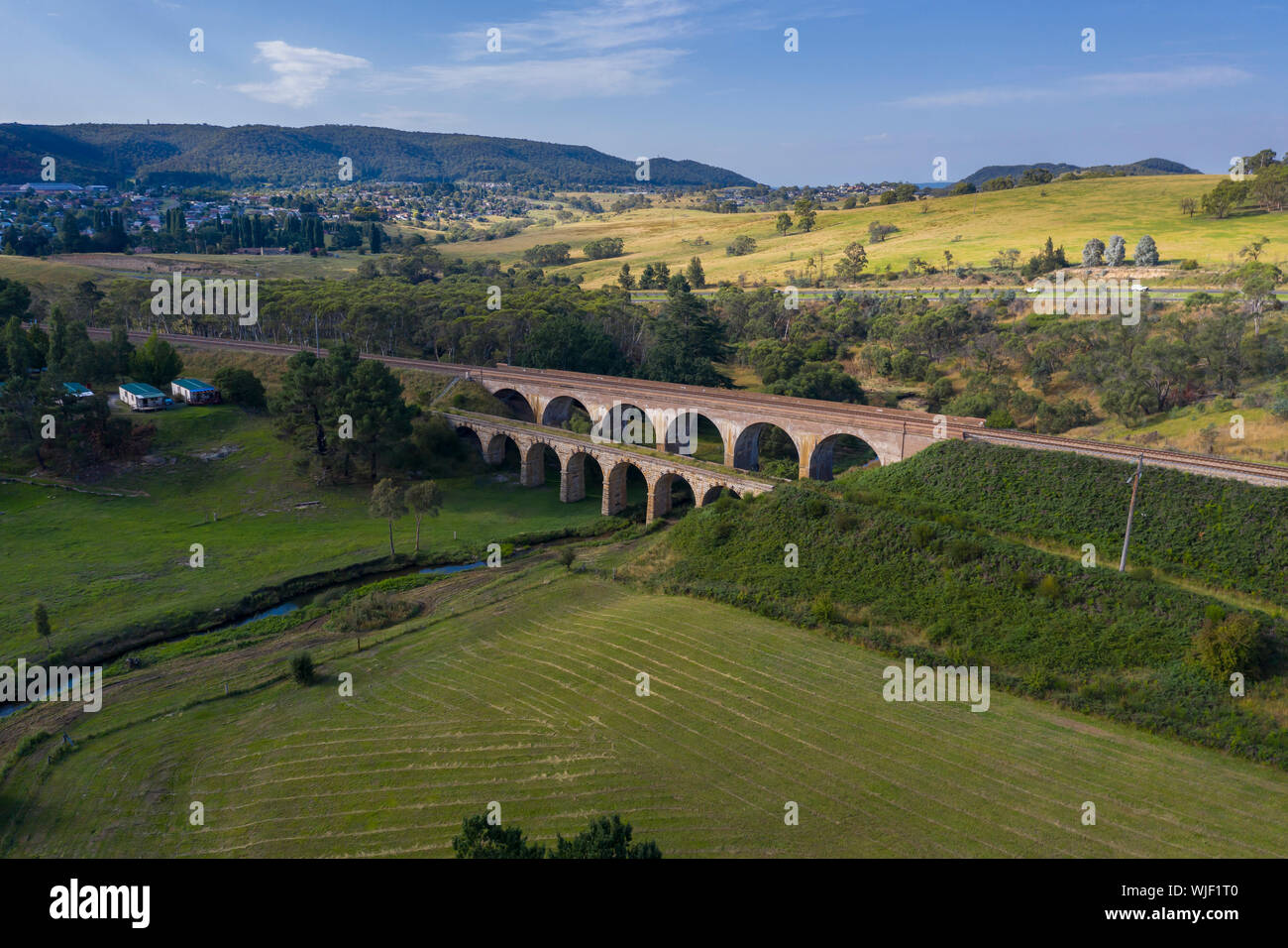 An old train viaduct in the countryside Stock Photo - Alamy