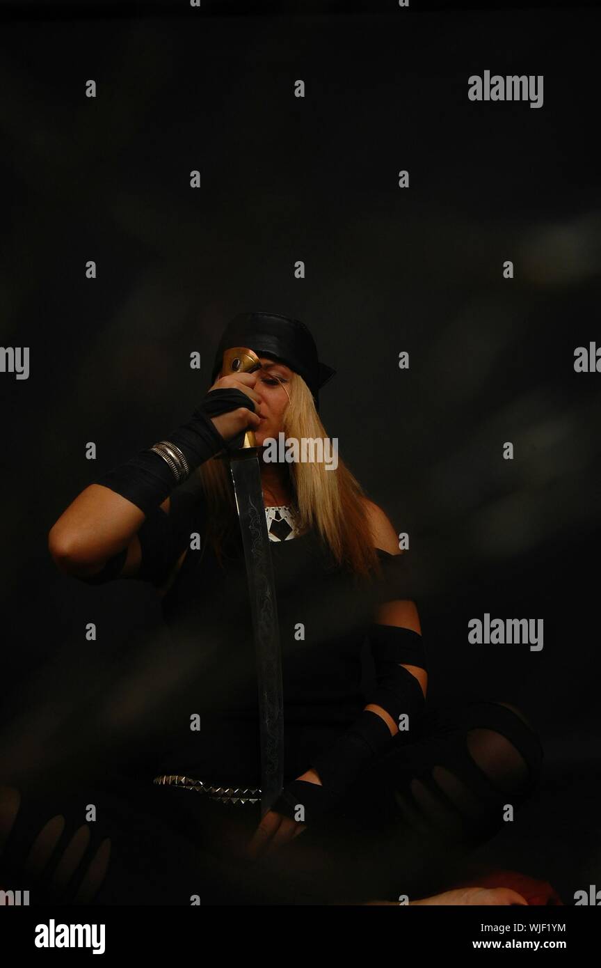 Woman and sword hi-res stock photography and images - Alamy