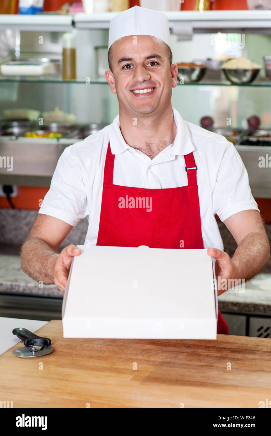 Chef handing hi-res stock photography and images - Alamy