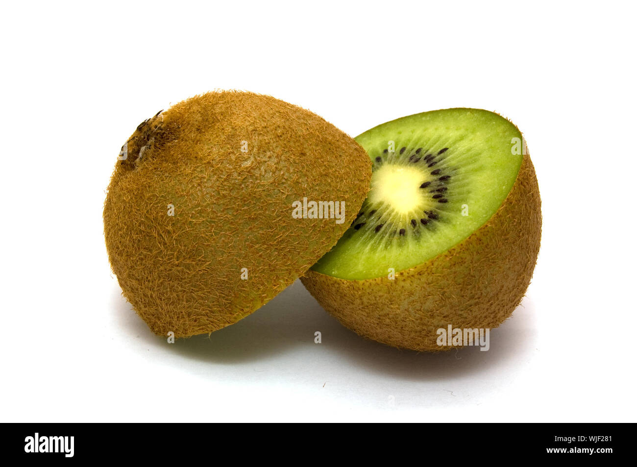 Parts of a kiwi on a white background Stock Photo - Alamy