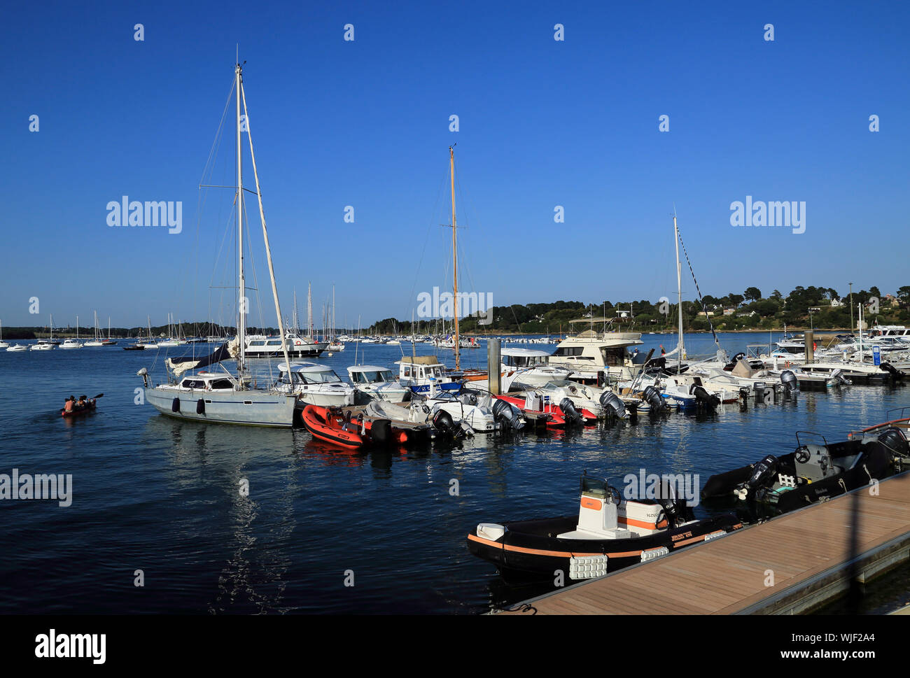 View of moored boats on jetty at marina from Rue Benoni Praud, Ile Aux ...