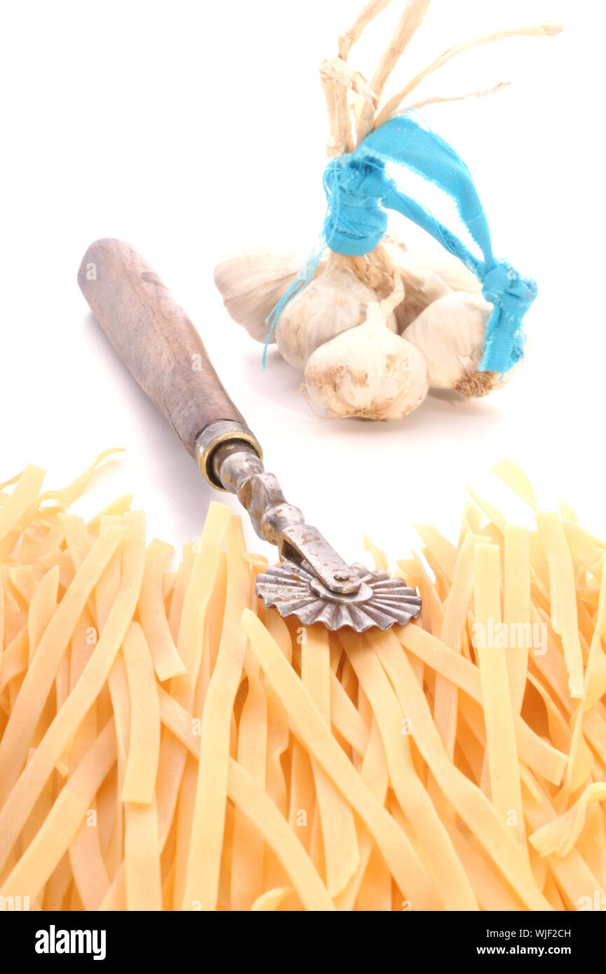 some home made spaghetti and tool to cut them Stock Photo - Alamy