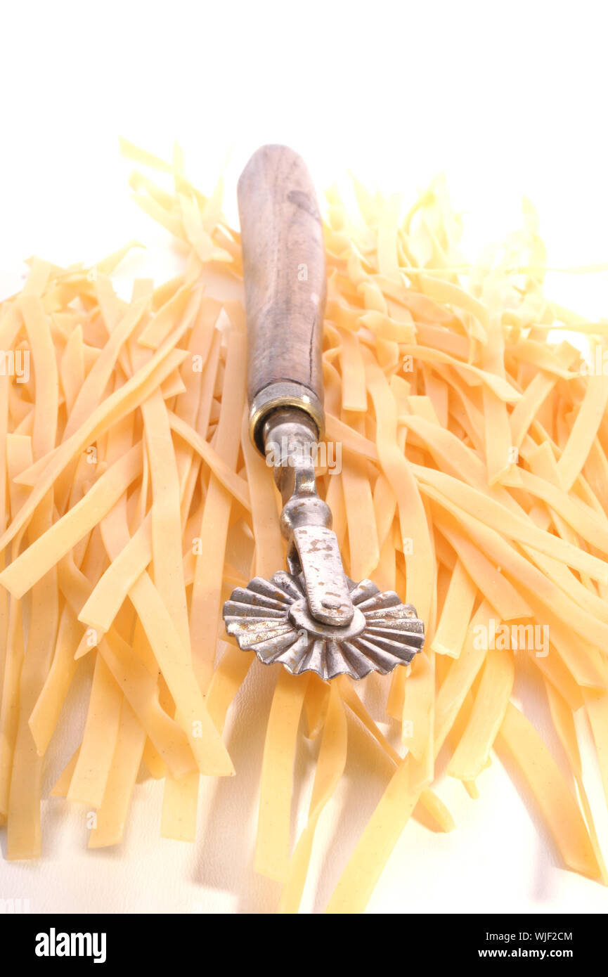 some home made spaghetti and tool to cut them Stock Photo - Alamy