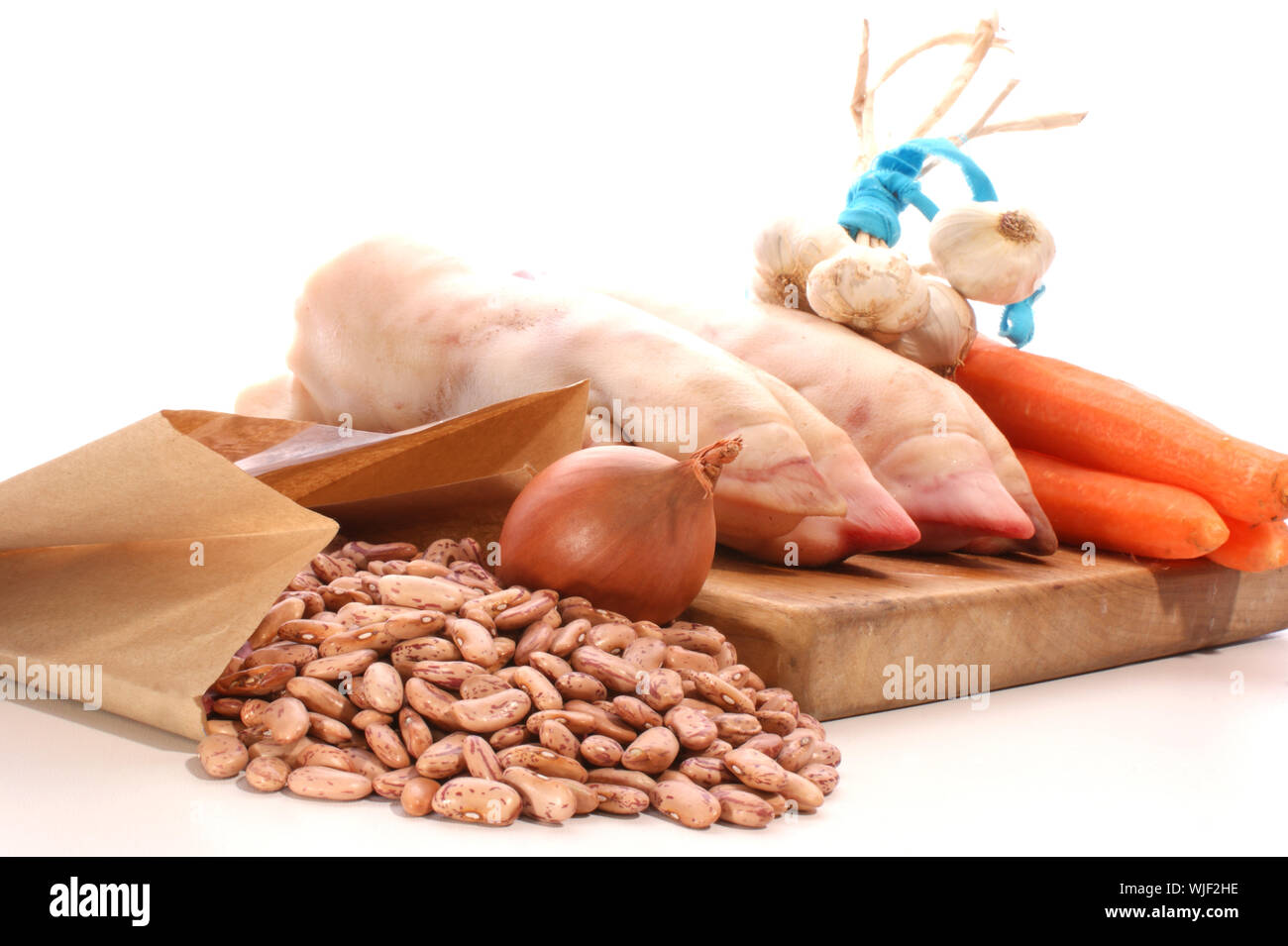 pig trotter and fresh vegetables to make bean soup Stock Photo - Alamy