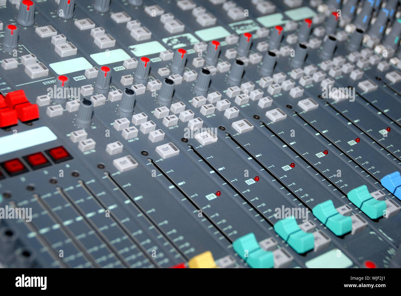 Audio mixing console in a recording studio. Faders and knobs of a sound ...