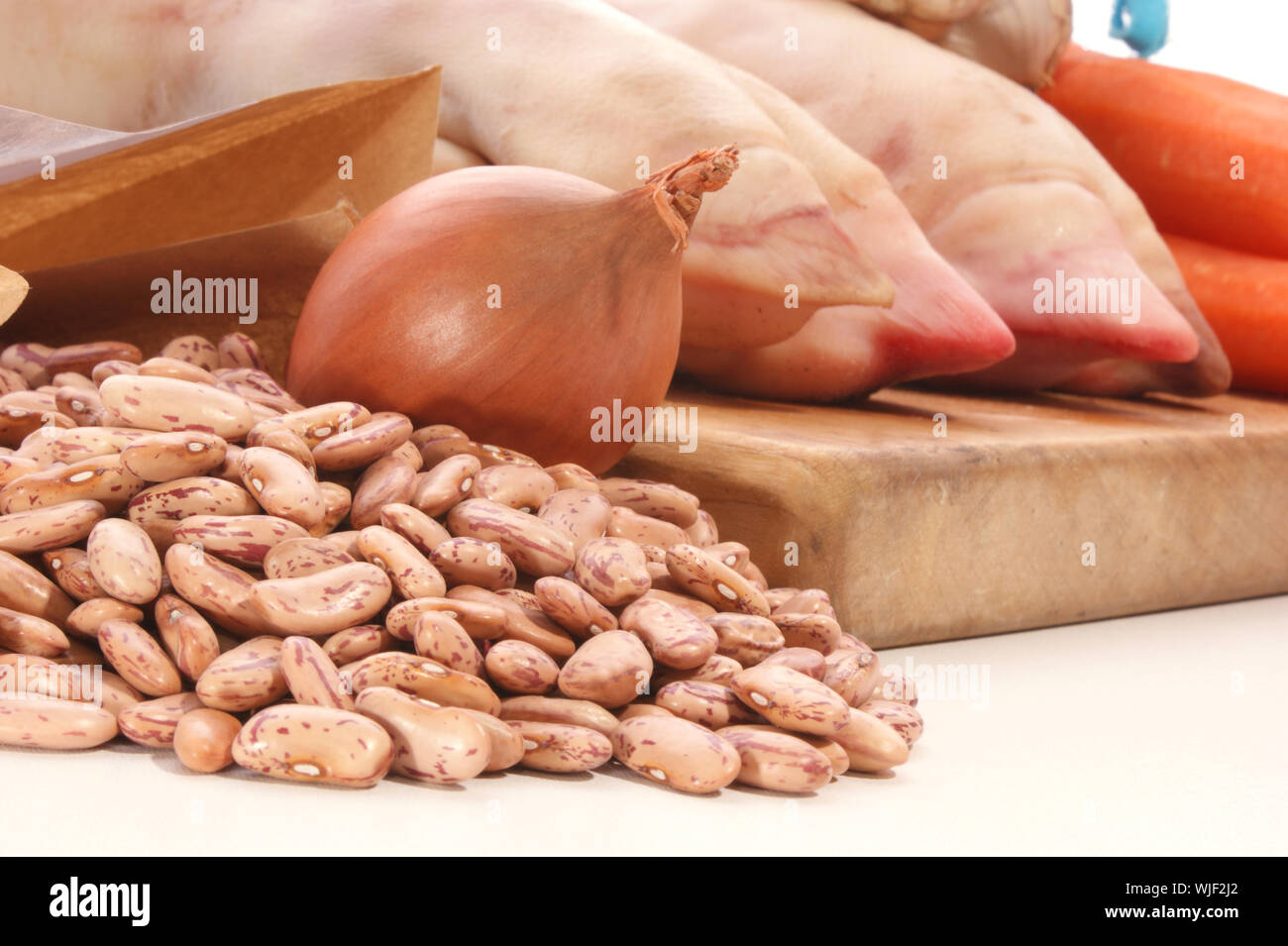 pig trotter and fresh vegetables to make bean soup Stock Photo - Alamy