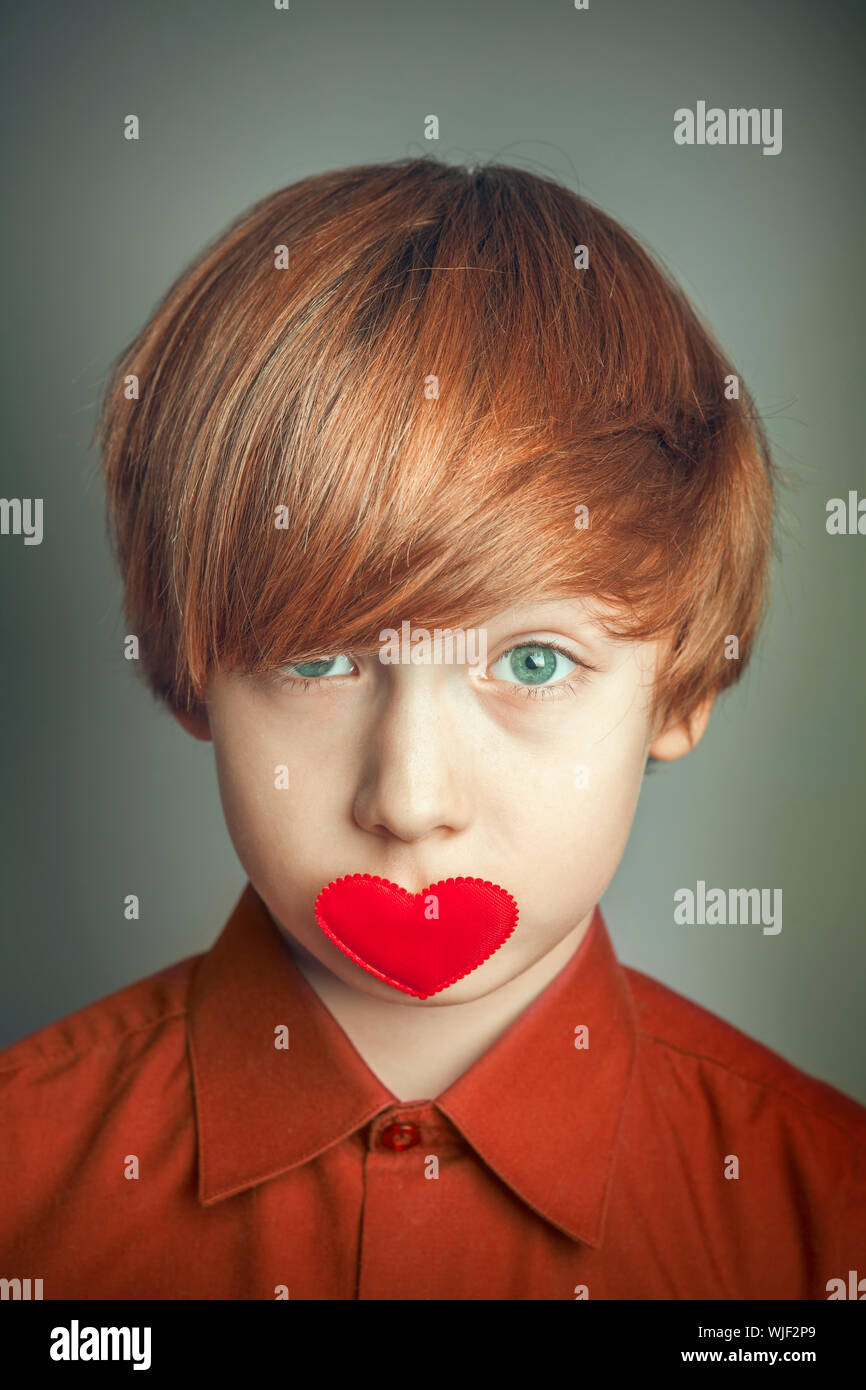 Portrait of a boy with hearts on face Stock Photo - Alamy