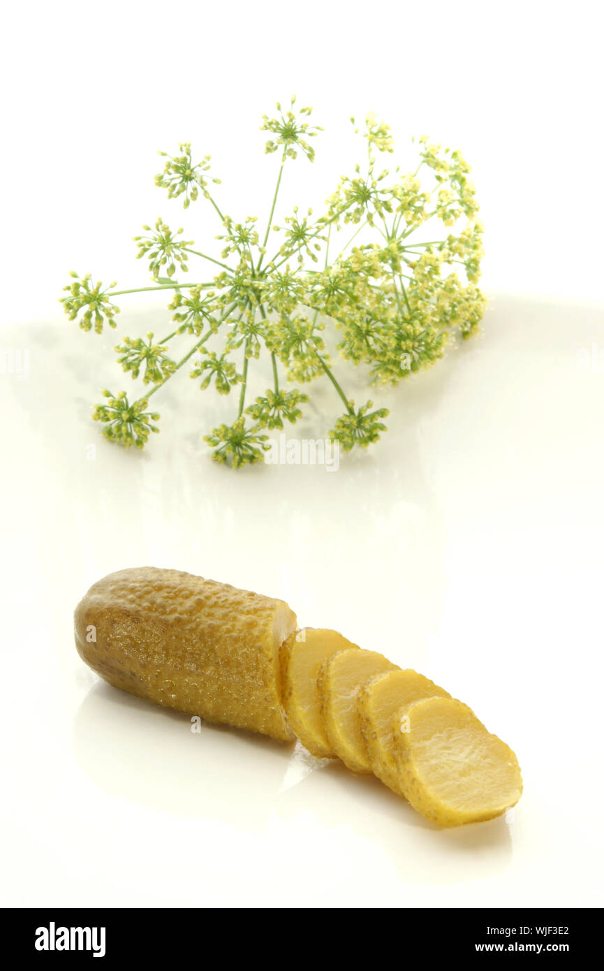one sour gherkin cut half into slices Stock Photo - Alamy