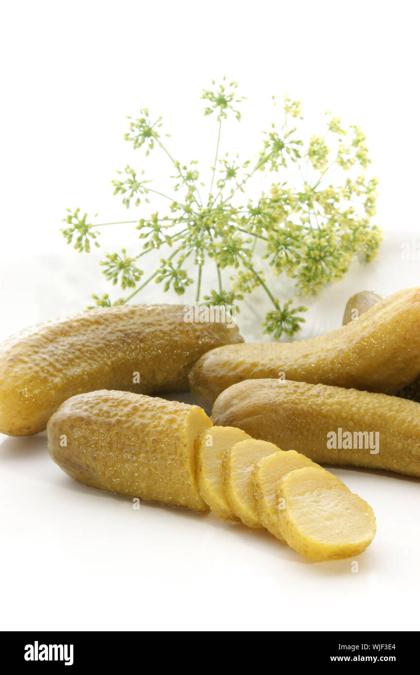 one sour gherkin cut half into slices Stock Photo - Alamy