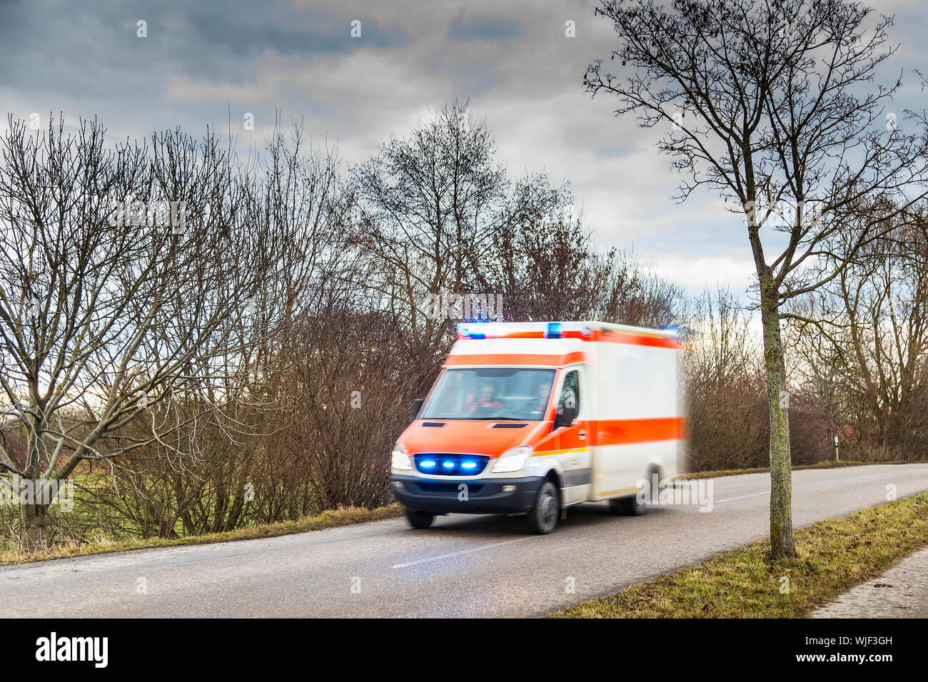 Image of fast driving ambulance car Stock Photo - Alamy