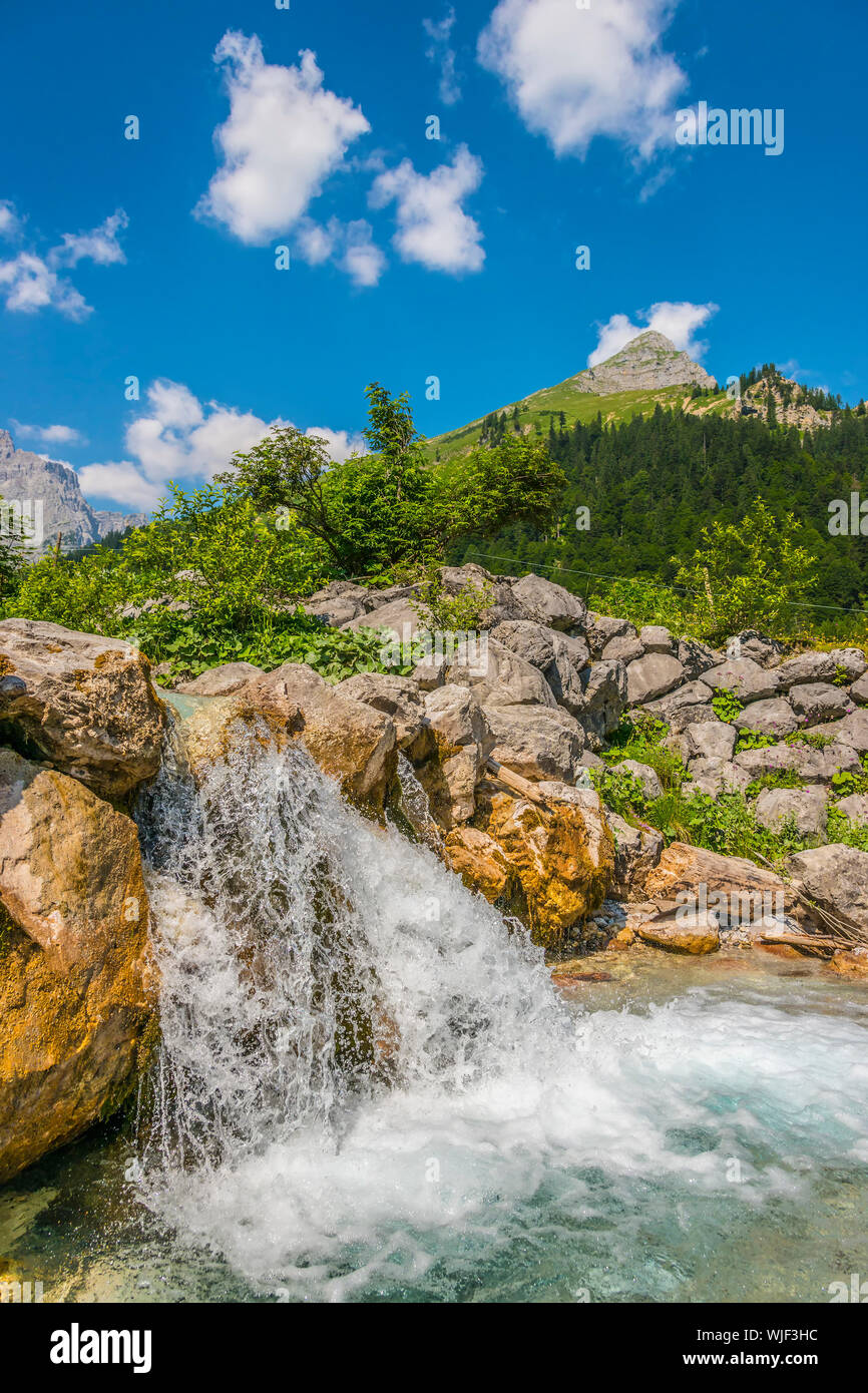 Picture of a waterfall and rocks in the Austrian Alps with trees and ...