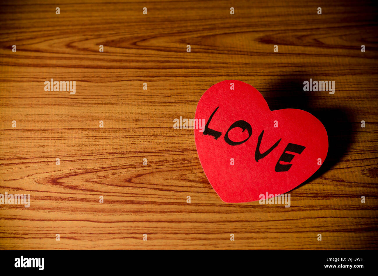 red heart word LOVE on wood vintage stlye background Stock Photo - Alamy